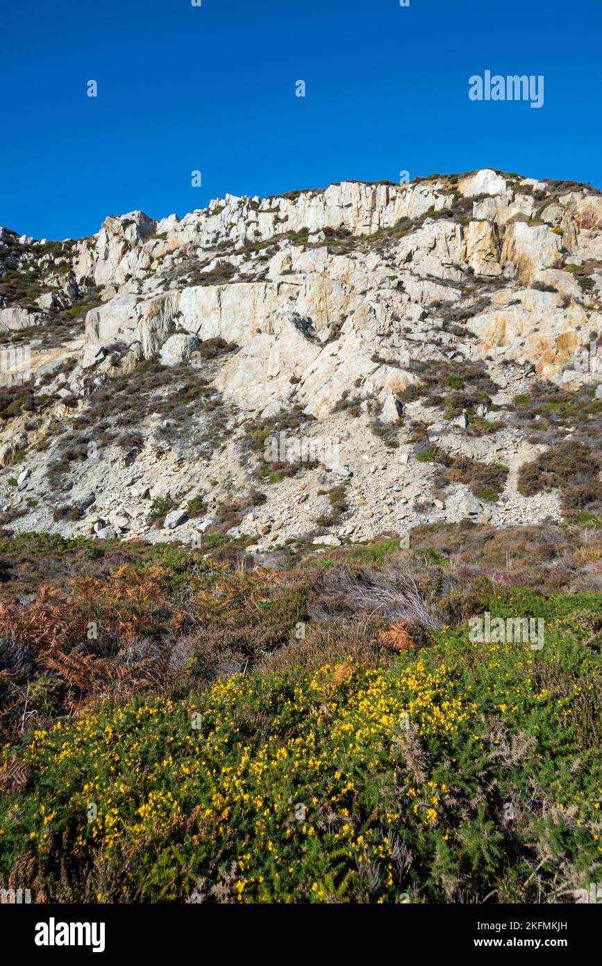 Dramatic rock face of old quarry at Breakwater Country Park, Holyhead ...
