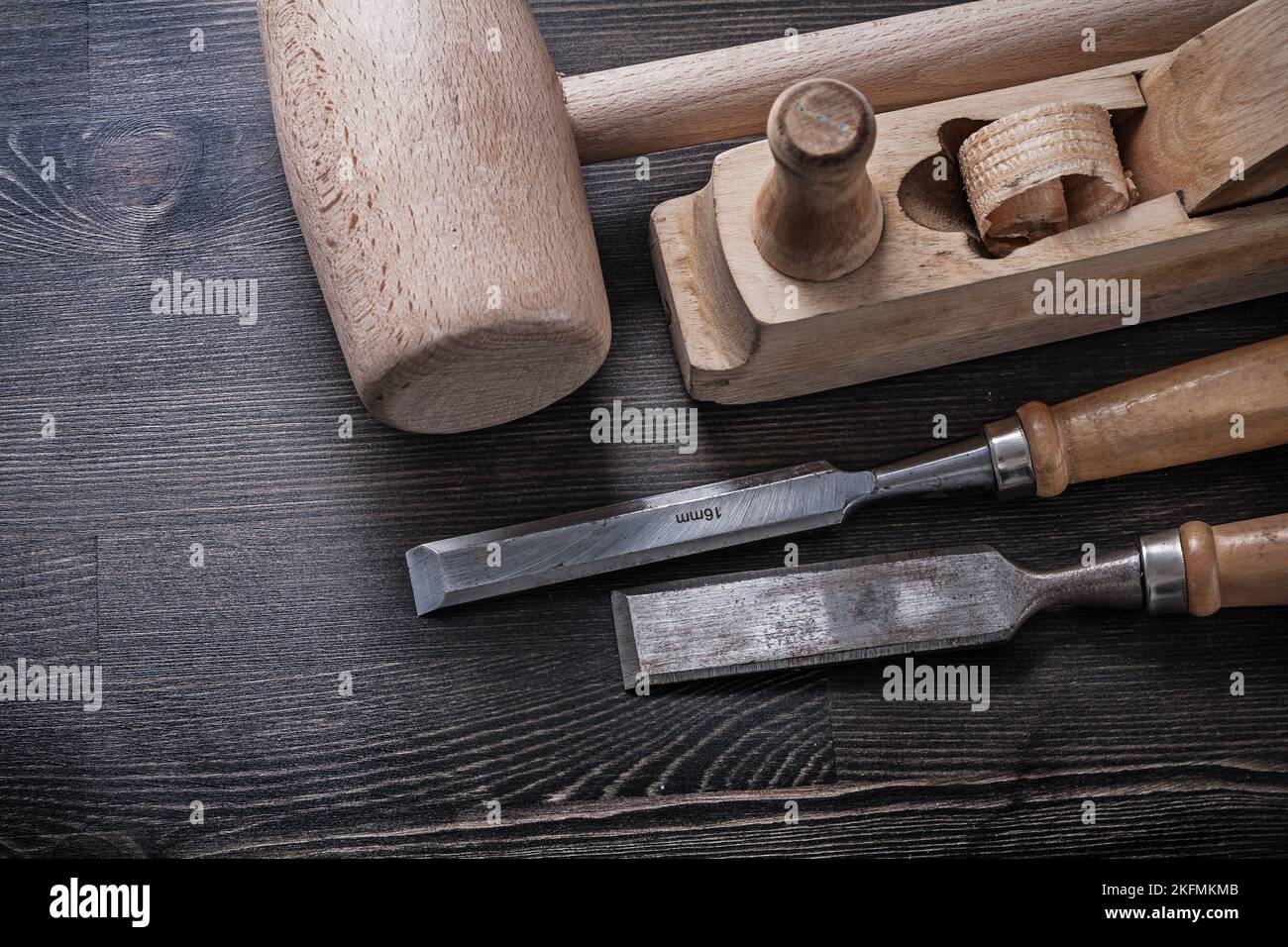 Wooden mallet flat chisels planer on wood board Stock Photo - Alamy