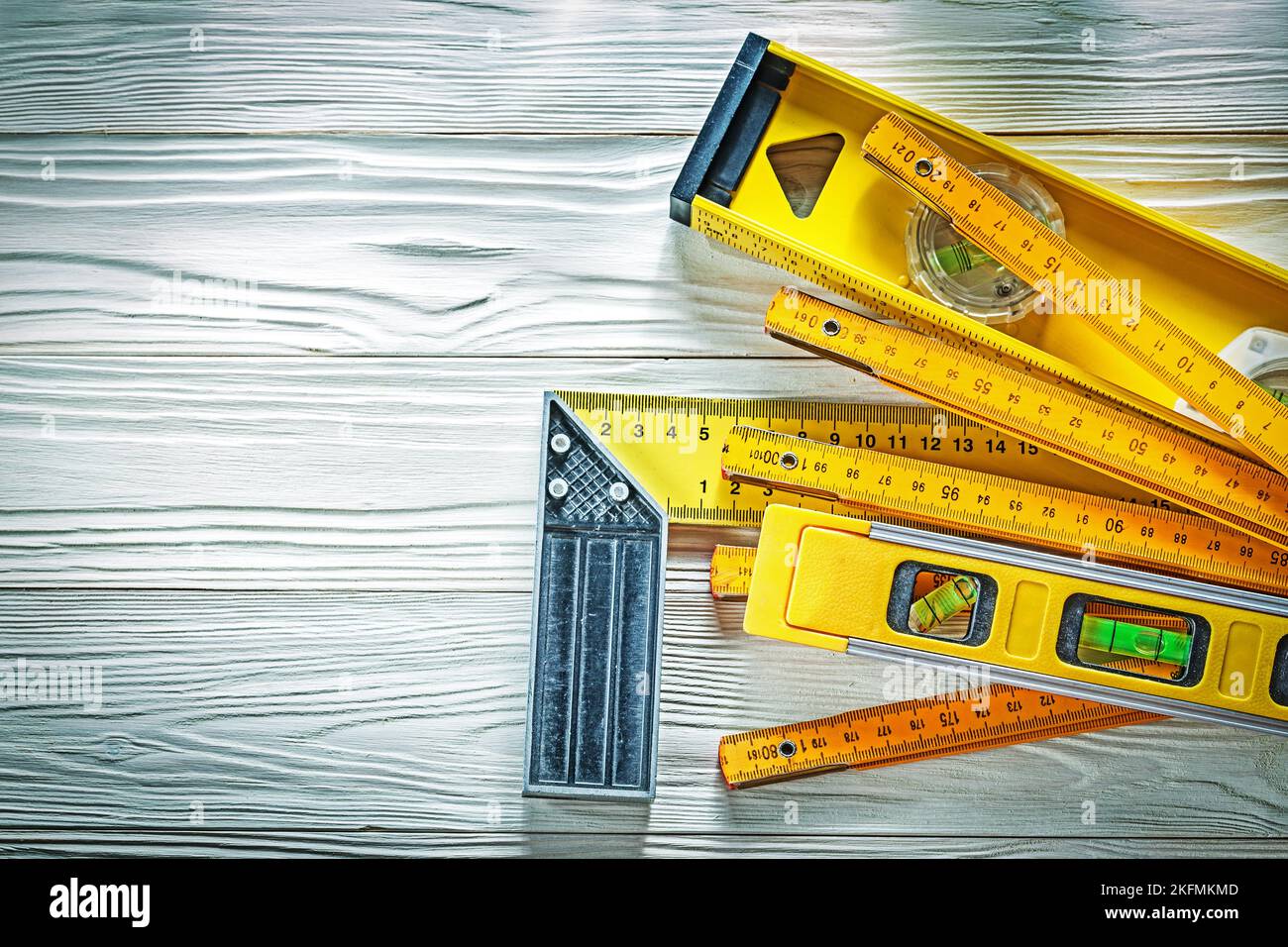 Wooden meter construction level square ruler on white board Stock Photo ...