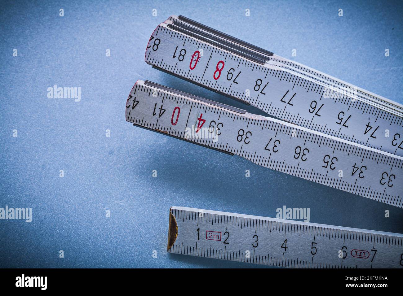 Wooden meter on metallic background construction concept Stock Photo ...