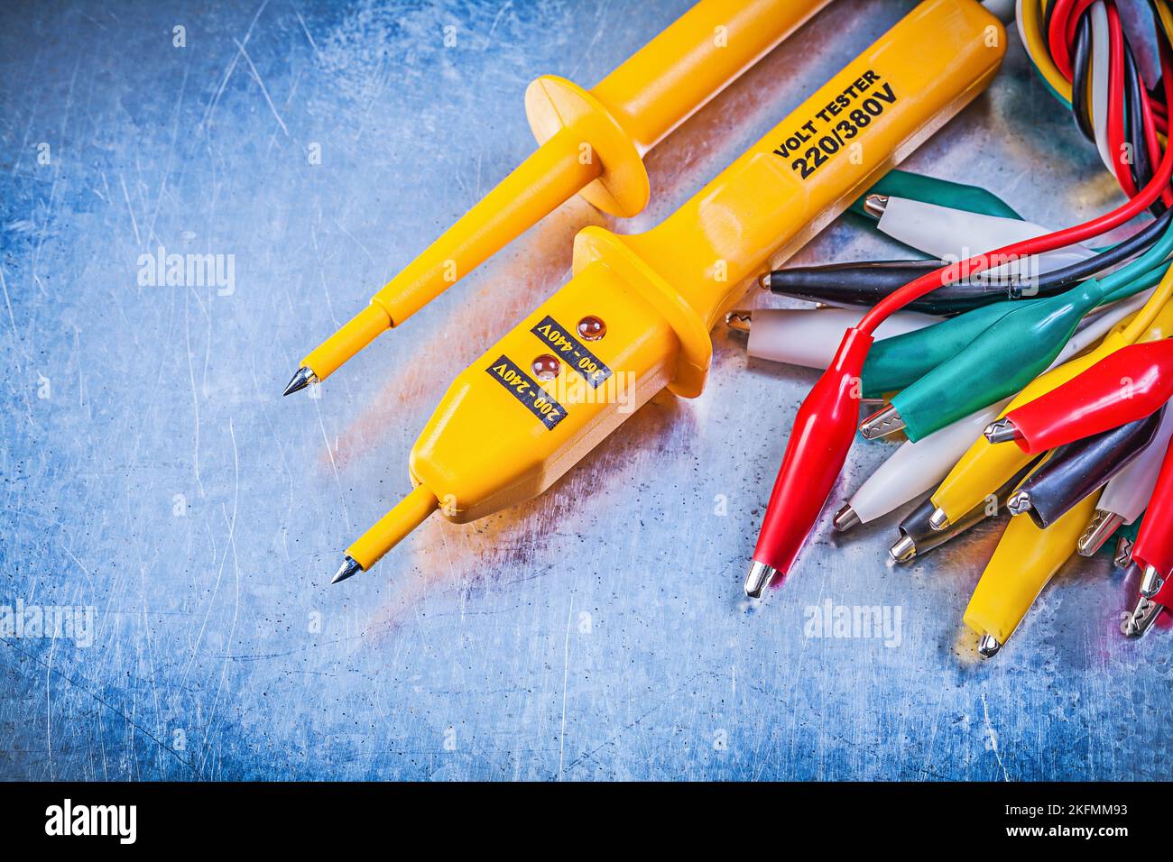 Yellow electrical tester set of multicolored crocodile clip cables on ...