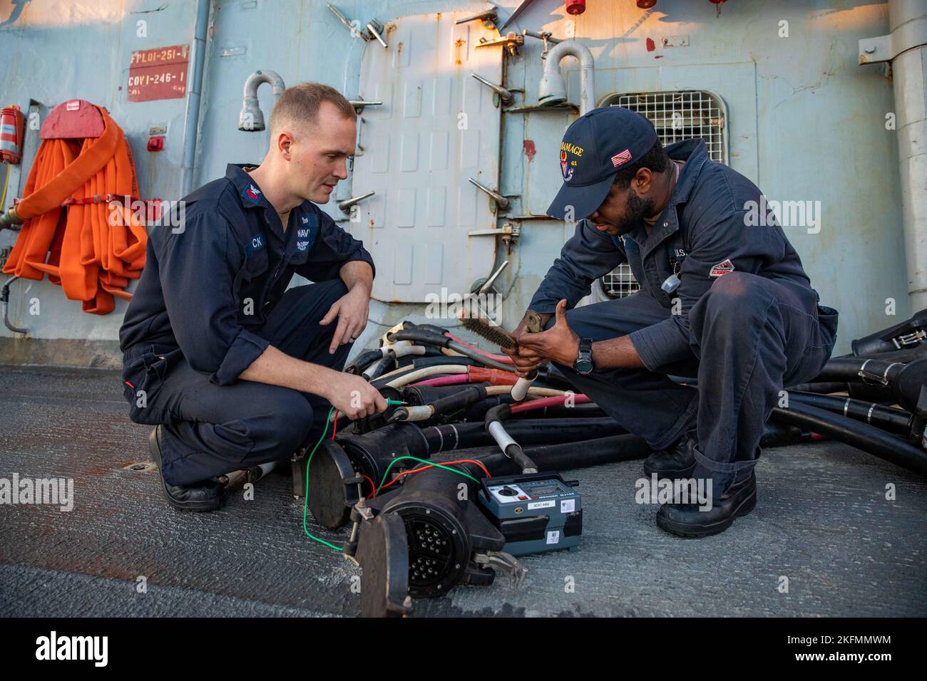 Electrician’s Mate 1st Class Alexander Mock, left, and Electrician’s ...