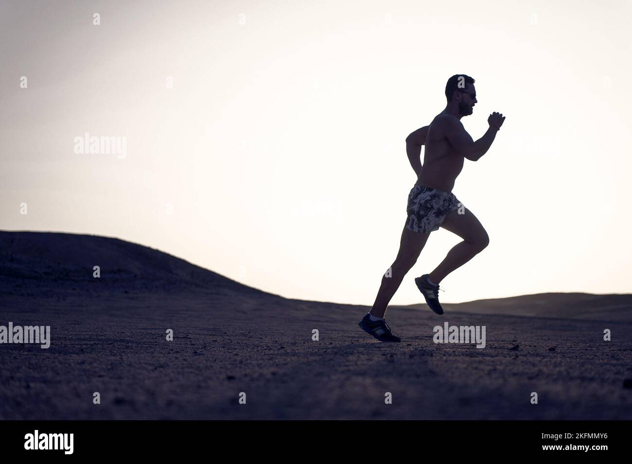 running man on mountain nature landscape on sky background Stock Photo ...