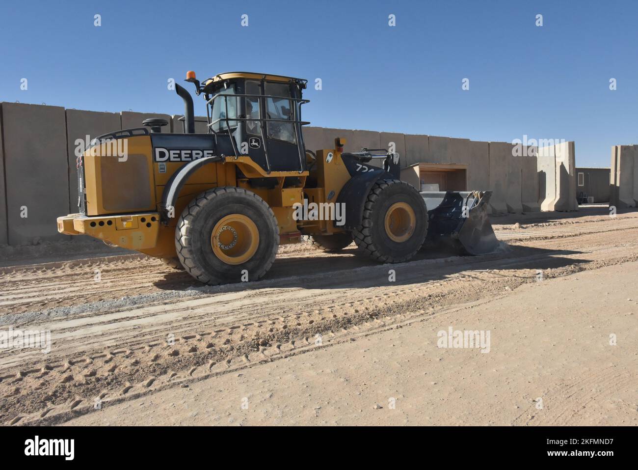 A John Deere 724K front loader operated by a Polish engineer with Task ...