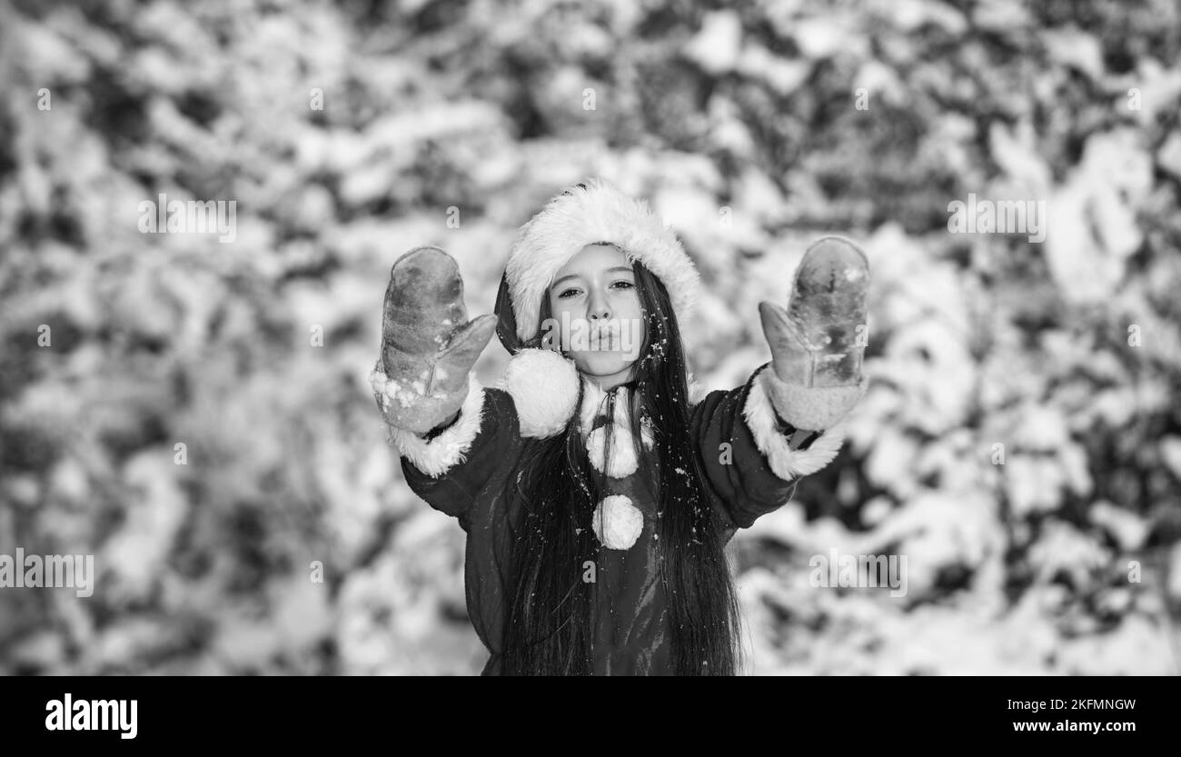 child in warm mittens. spend winter holiday with joy. santa claus ...