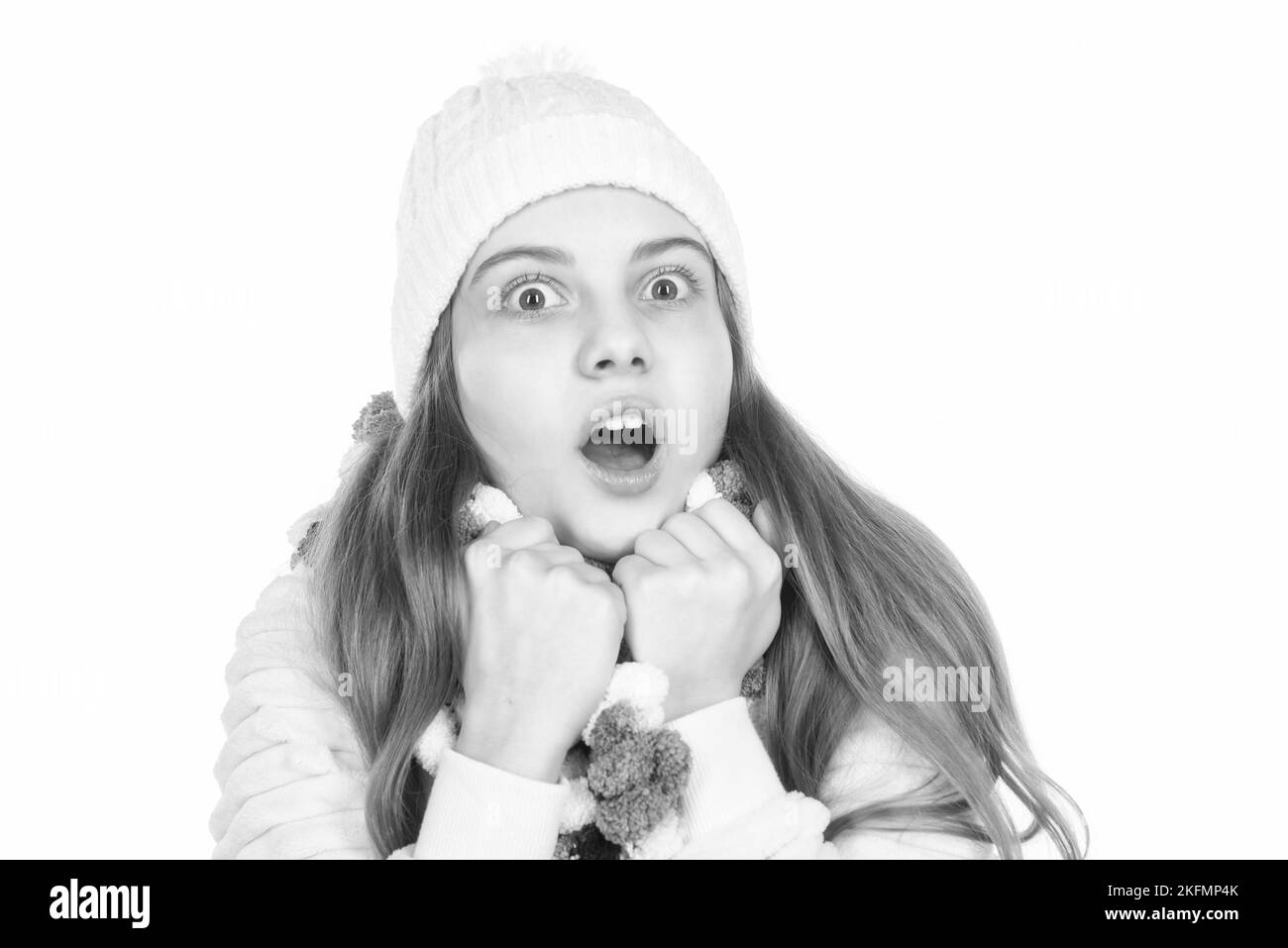 so cold. surprised teen girl in winter clothes feel cold. childhood ...