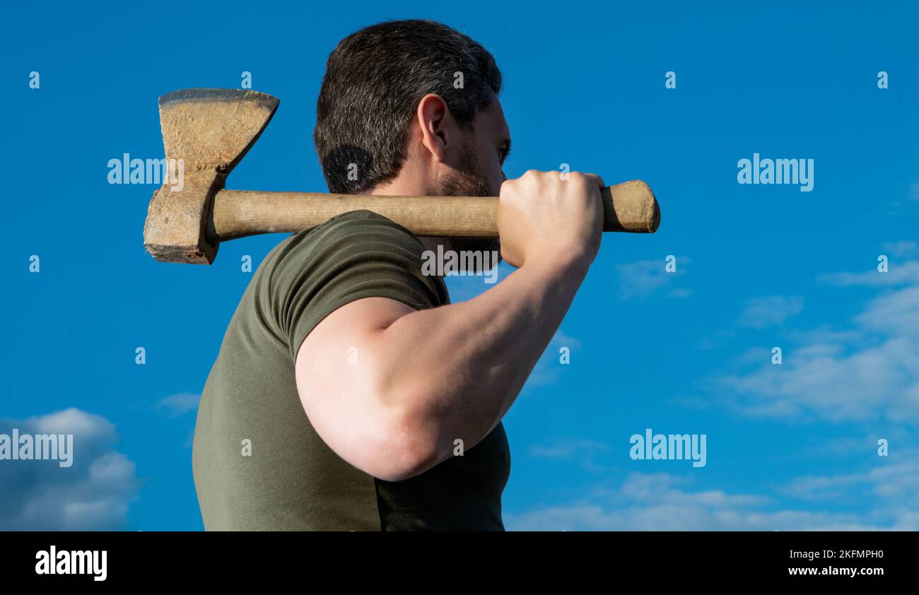 back view of guy with axe. lumberjack man hold ax. brutal man on sky ...