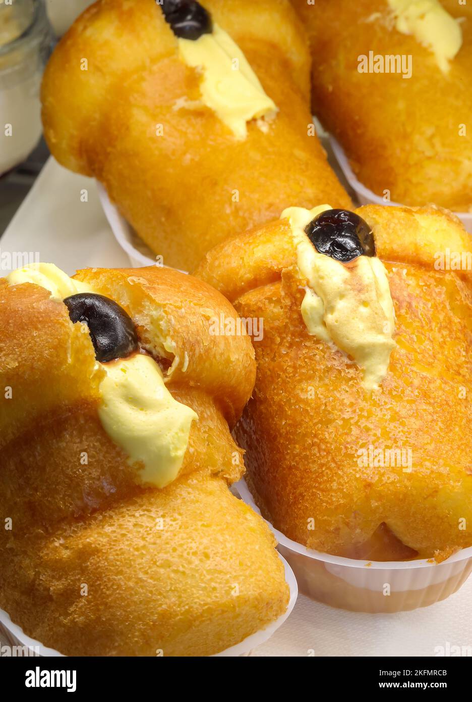 rum baba with cherries and custard in pastry Stock Photo - Alamy