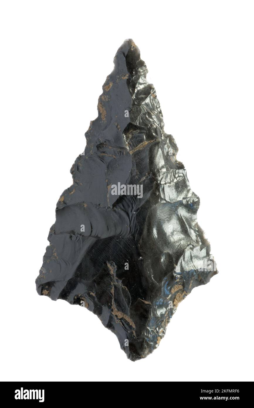 Neolithic obsidian arrowhead on white background Stock Photo - Alamy