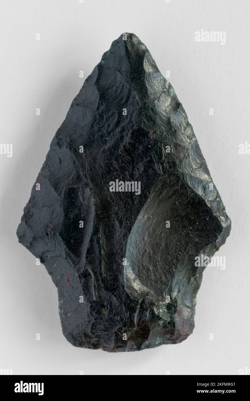 Neolithic obsidian arrowhead on white background Stock Photo - Alamy