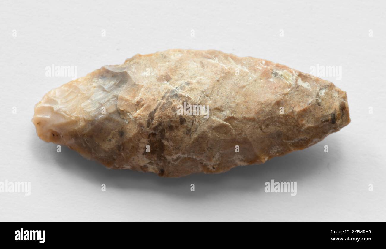 Neolithic flint arrowhead on white background Stock Photo - Alamy