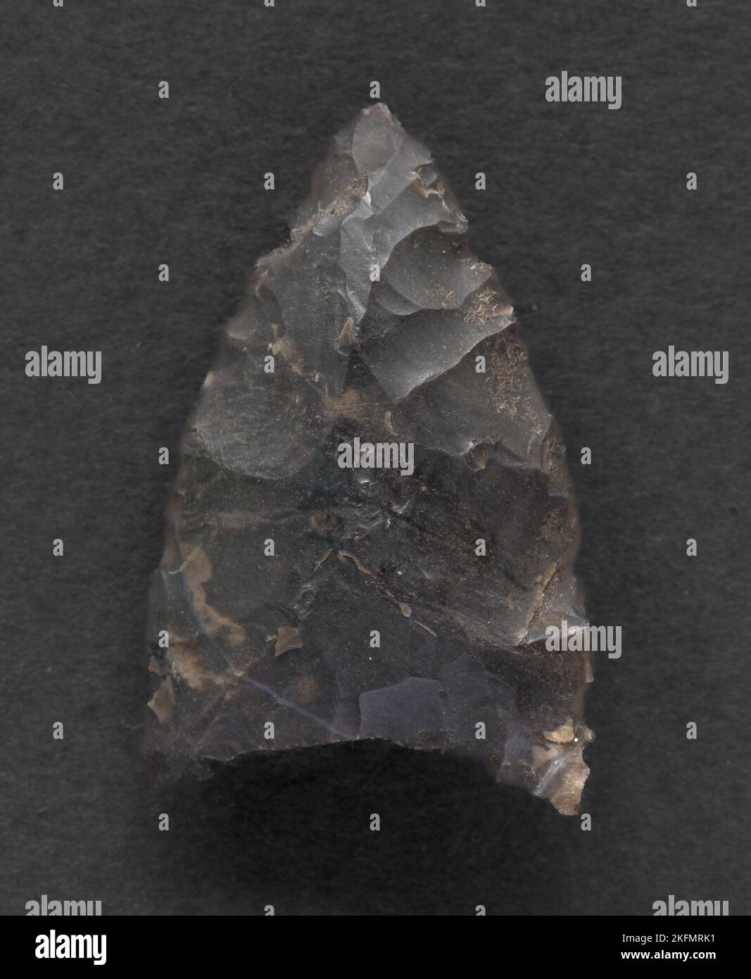 Neolithic flint arrowhead on white background Stock Photo - Alamy