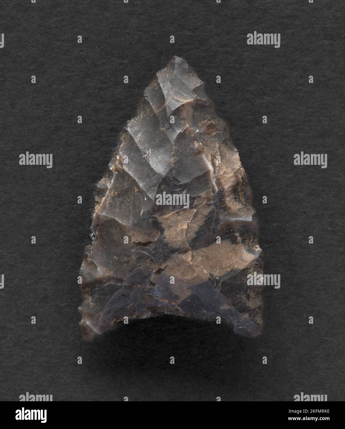 Neolithic flint arrowhead on white background Stock Photo - Alamy