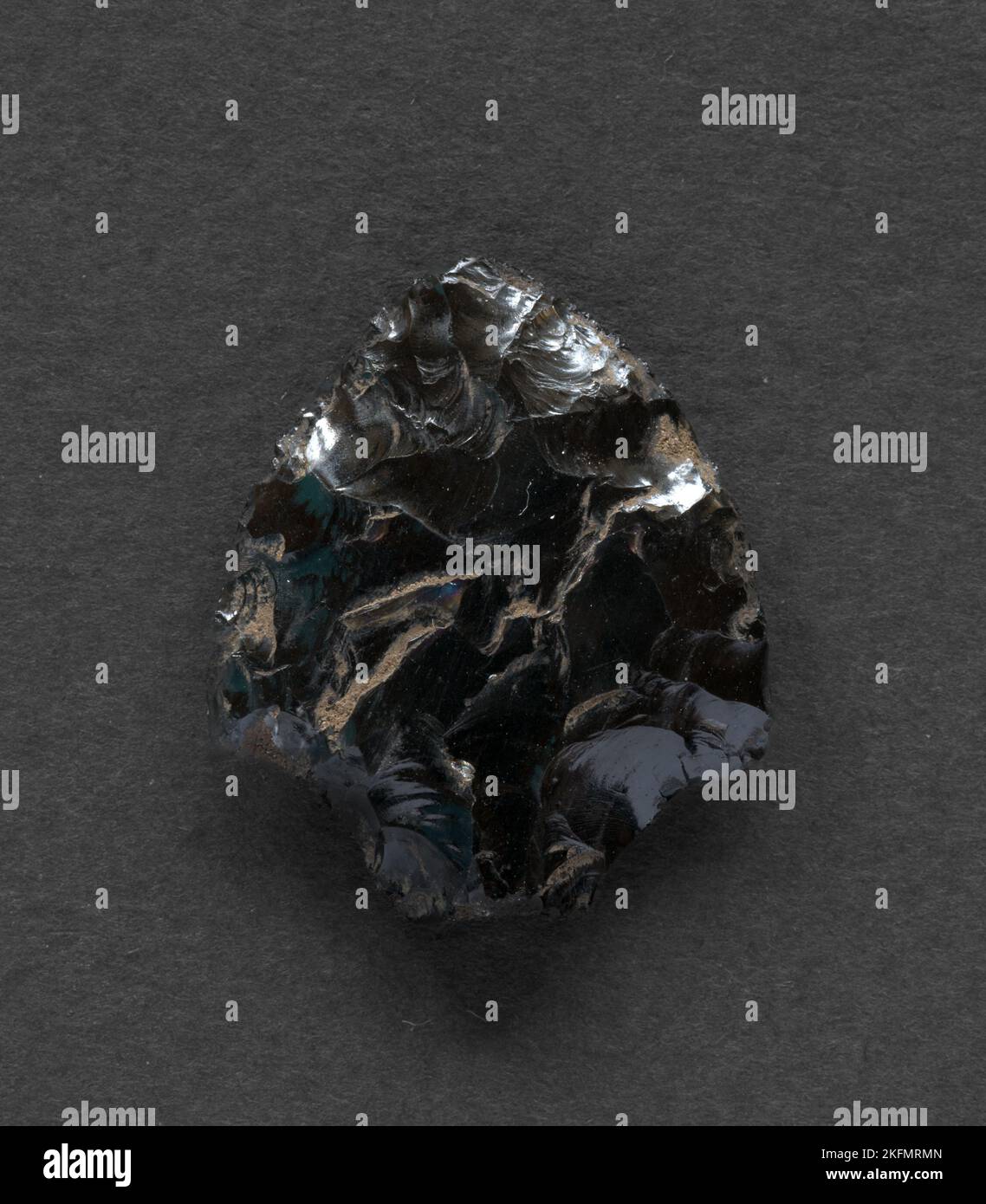 Neolithic obsidian arrowhead on dark background Stock Photo - Alamy