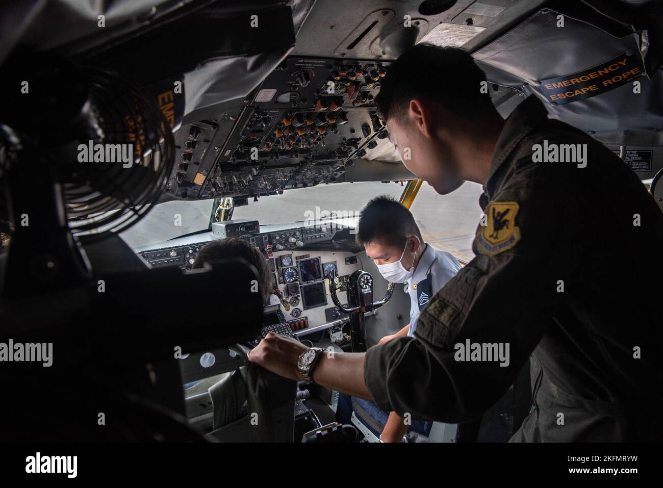 Japanese Air Self Defense Force cadets are shown the cockpit of a KC ...
