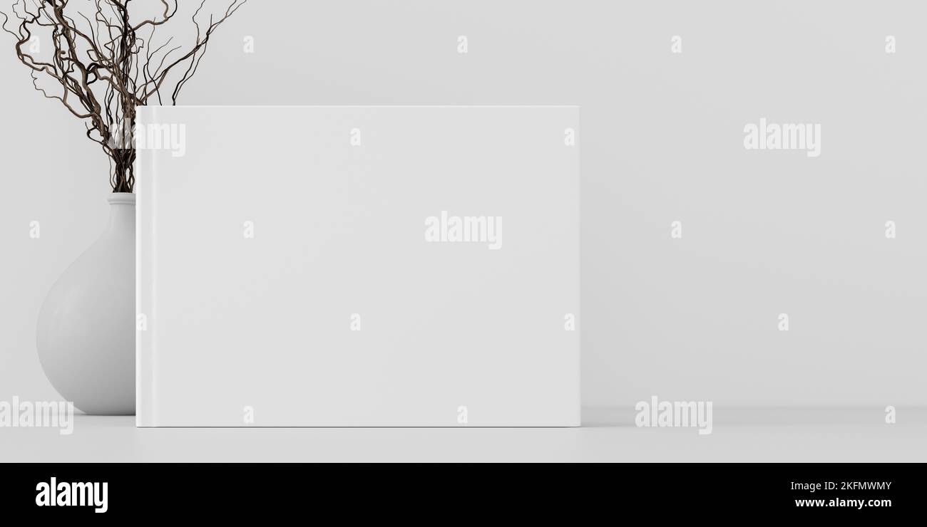 Horizontal book cover mock up standing on a white desk with white wall ...