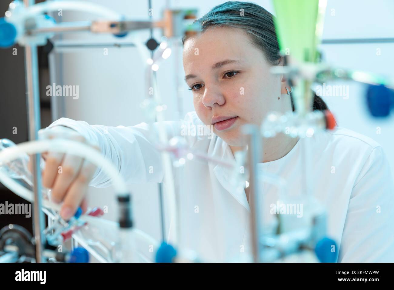 chemical experiment in a science laboratory young woman laboratory ...