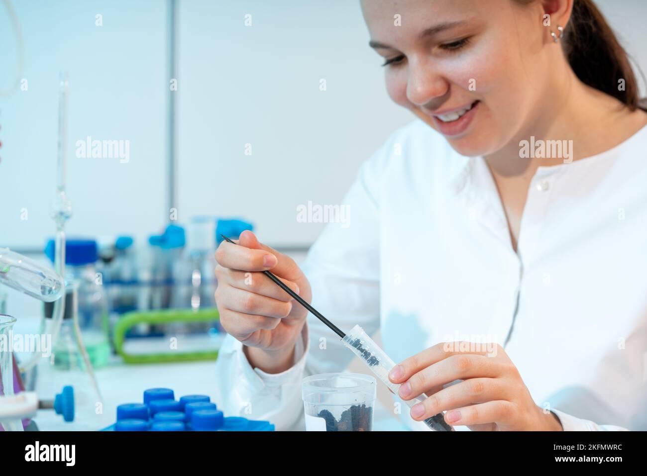 soil analysis for harmful chemicals in an agronomy laboratory young ...