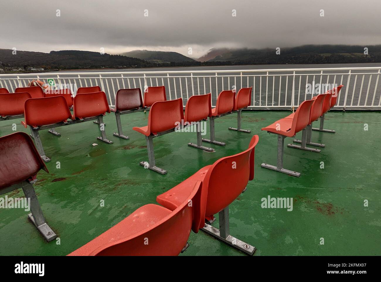 Orange outdoor seats on Calmac ferry Stock Photo - Alamy