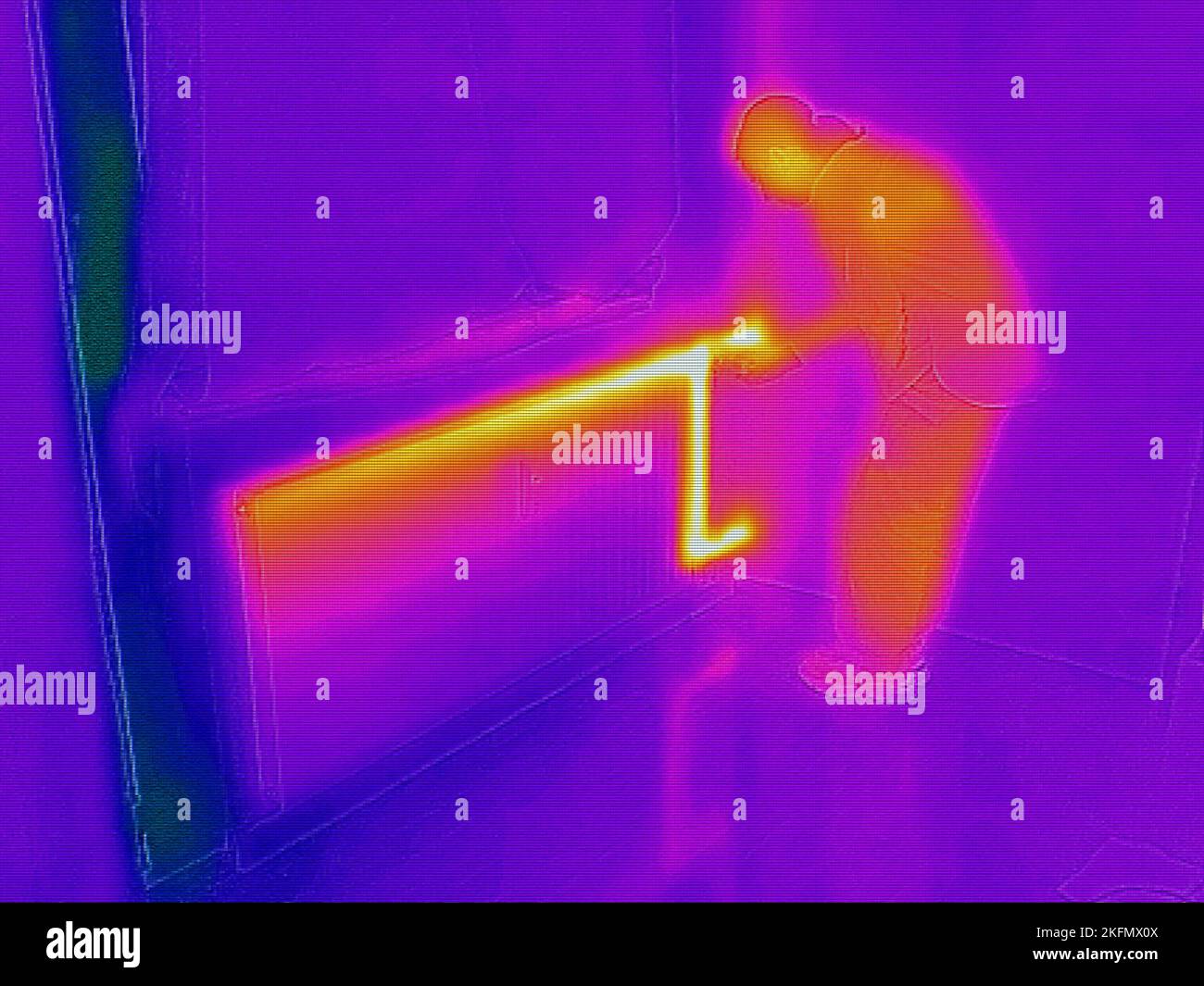 infrared thermal photography of a young woman adjusting the temperature ...