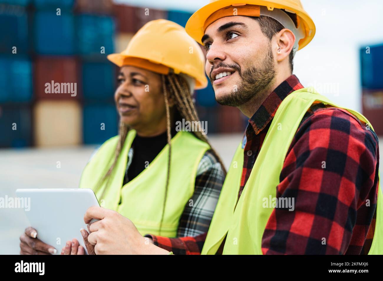 Industrial engineers working in the logistic terminal of container ...