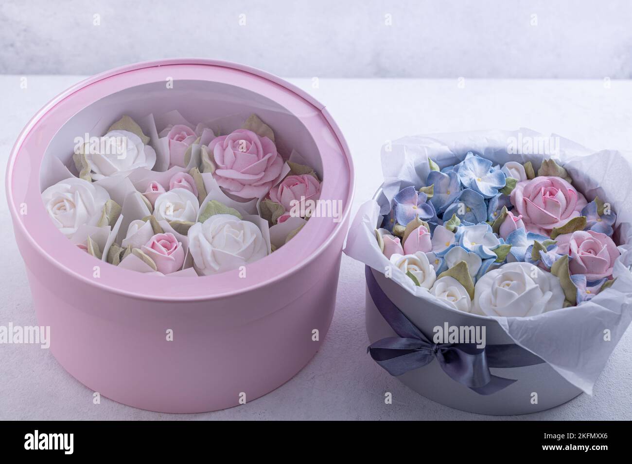 zephyr bouquet of flowers in a pink box on a light background, holiday ...