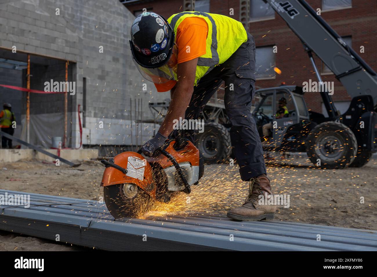 Travis Hayward, a team leader with CSI Electrical Contractors Inc cuts ...