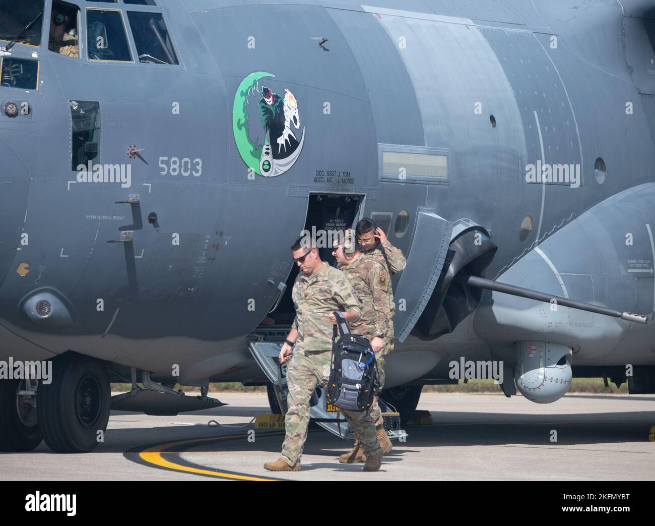 Airmen with the 1st Special Operations Wing disembark from an AC-130J ...