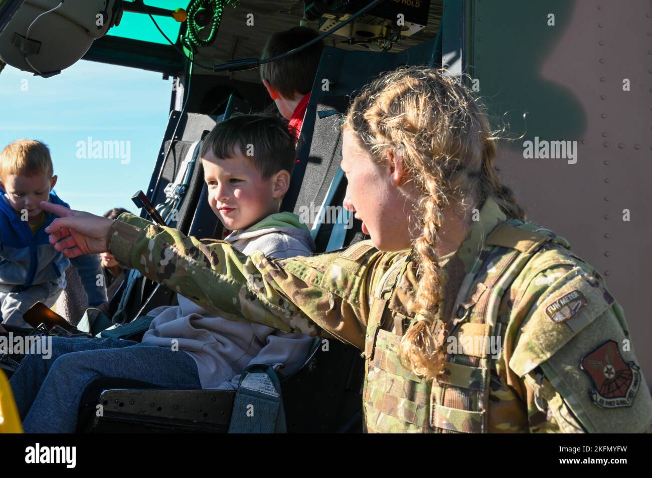 1st Lt. Sarah Melton, a 54th Helicopter Squadron pilot, shows a child ...