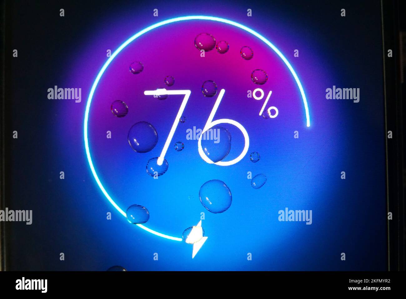 smartphone battery indicator screen with waterdrops Stock Photo - Alamy