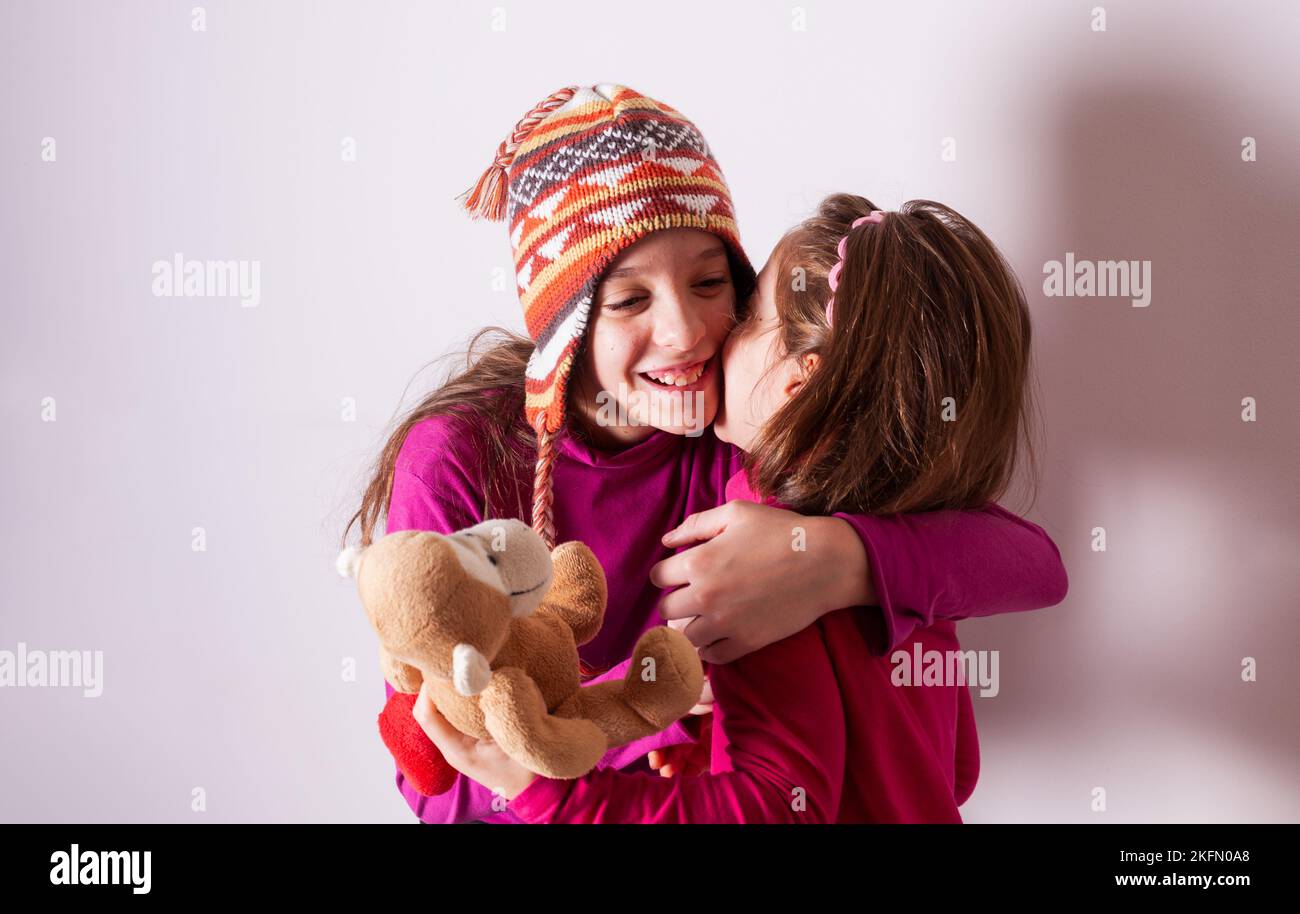 Happy and healthy young little girls hugging and smiling. Best friend ...