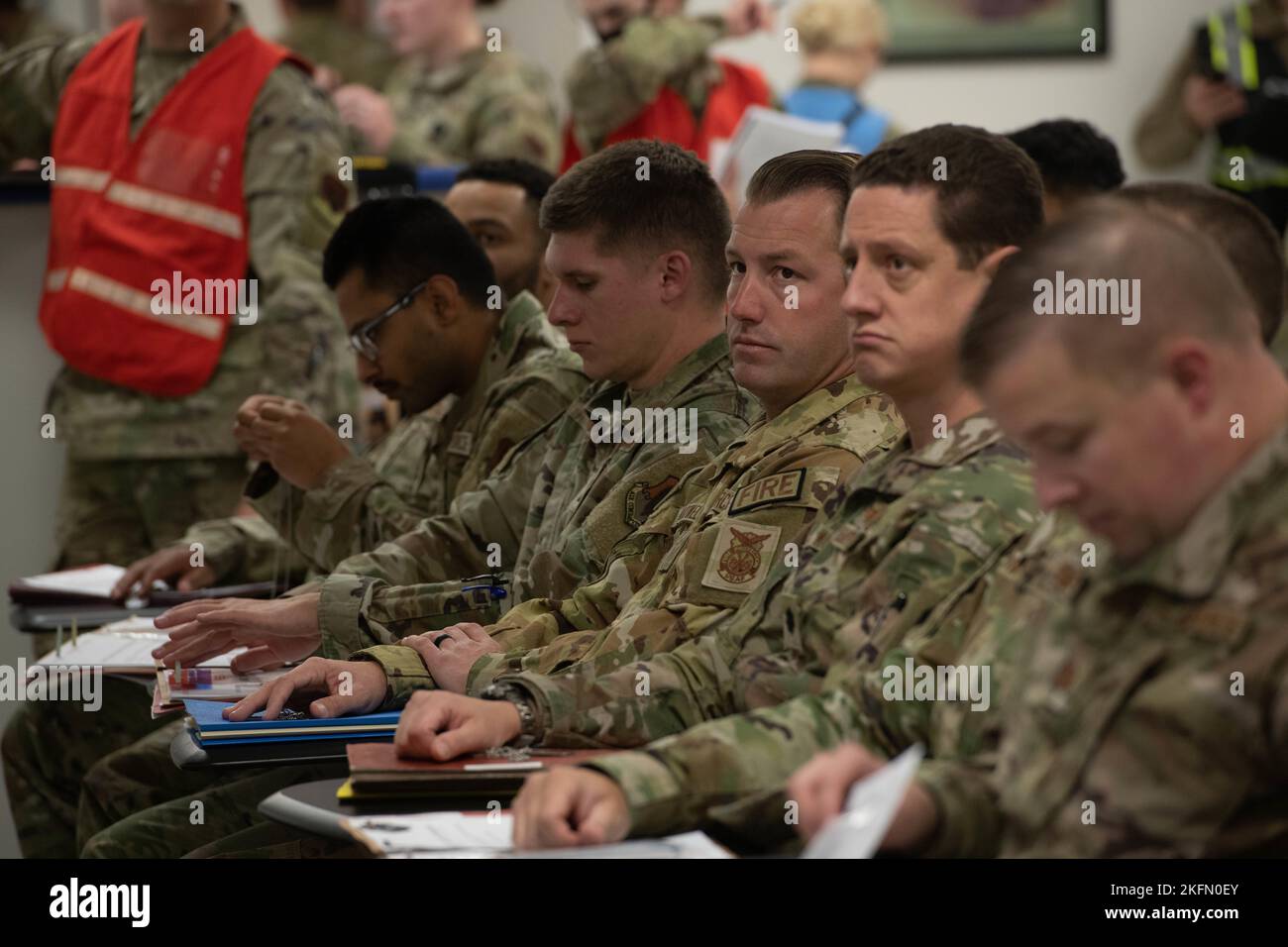 Airmen assigned to the 319th Reconnaissance Wing attend a briefing Sept ...