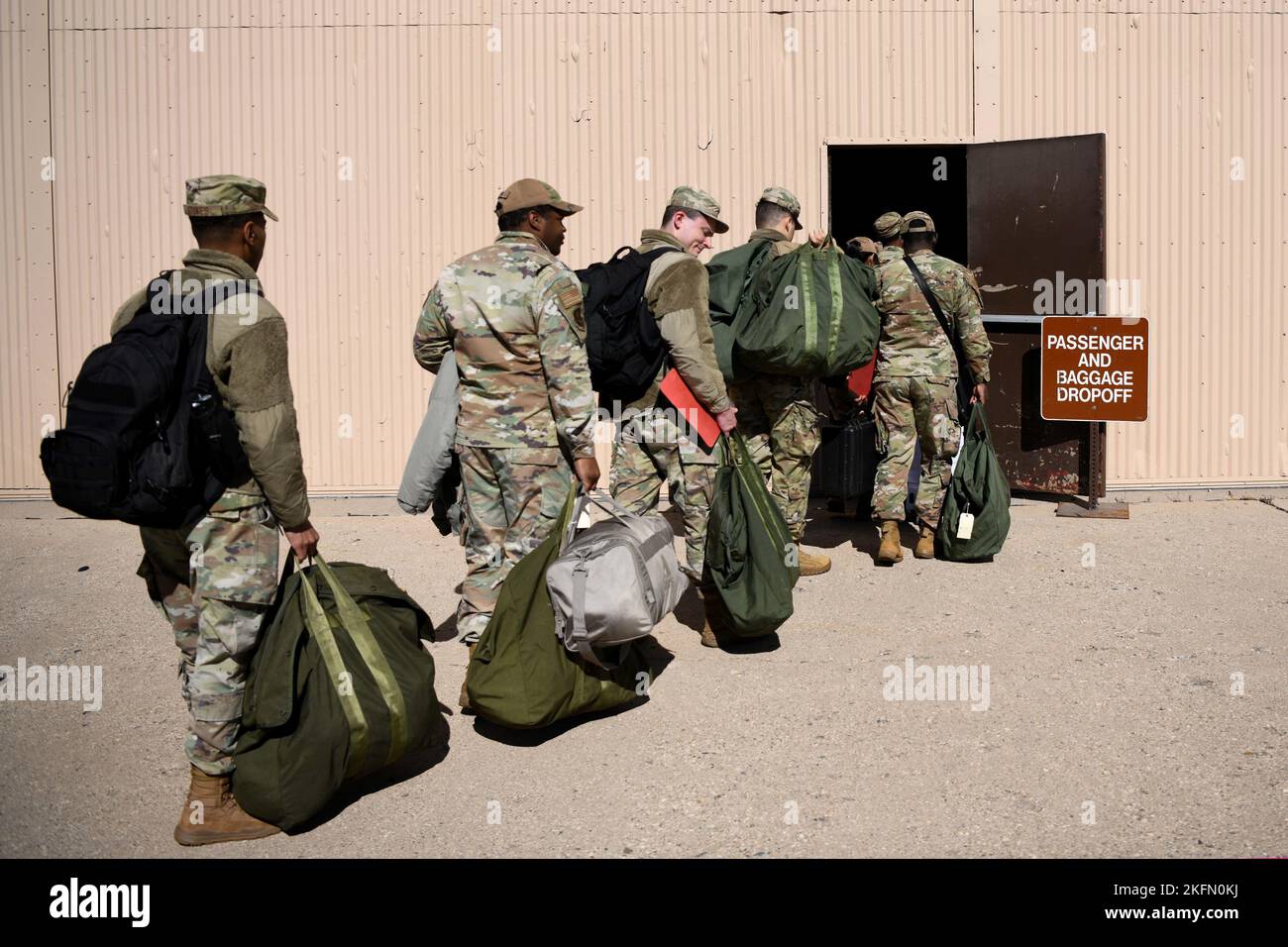 Airmen from the 319th Reconnaissance Wing carry deployment bags Sept ...