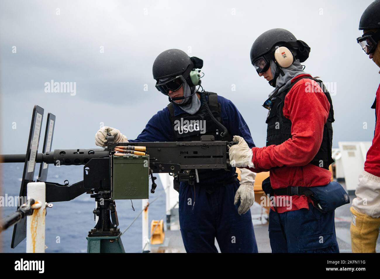 U.S. Coast Guard Petty Officer 3rd Class Ian Eckelberg, a gunner’s mate ...