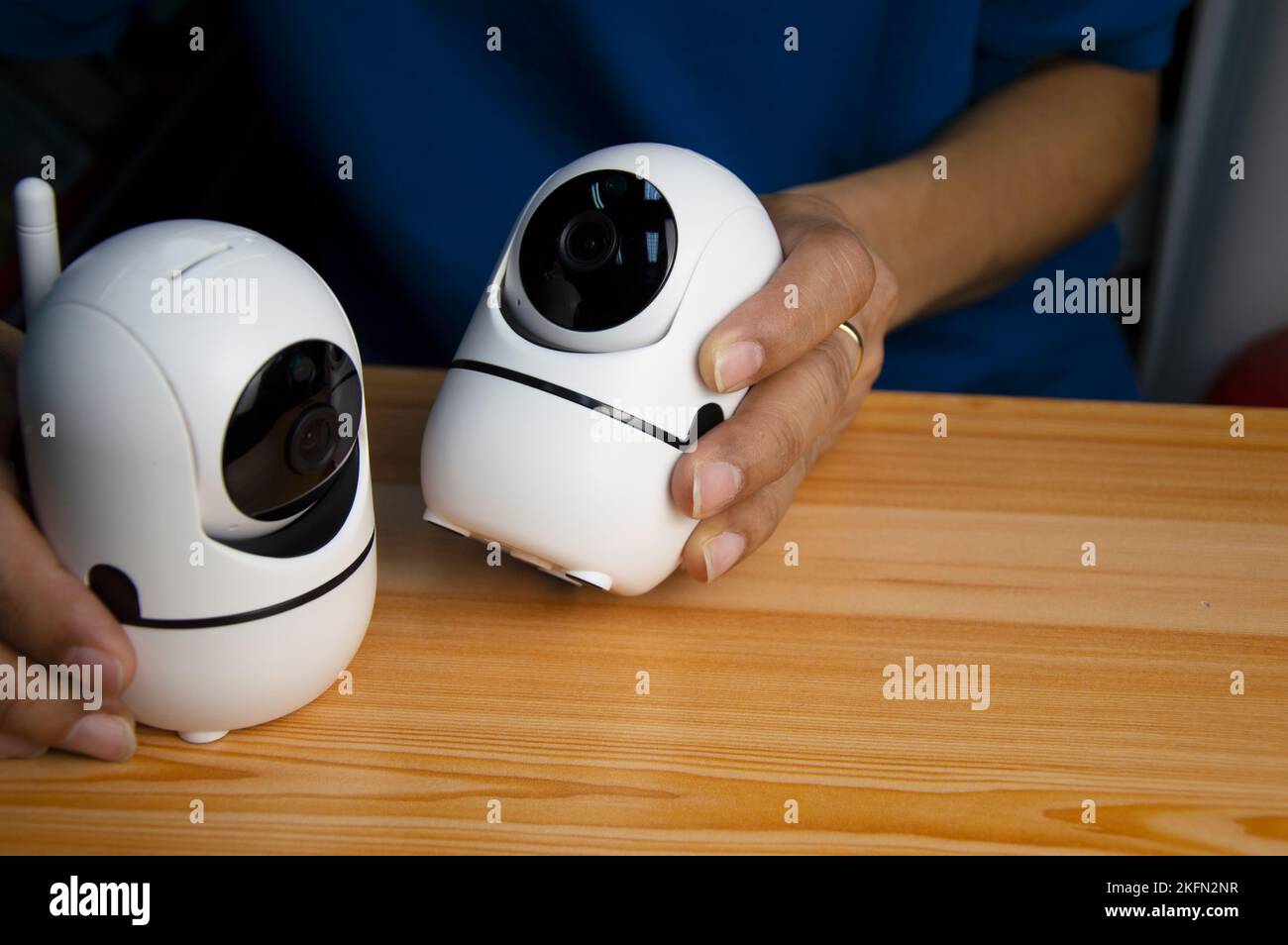 Conceptual man operating ip camera,White IP cameras, very popular for ...