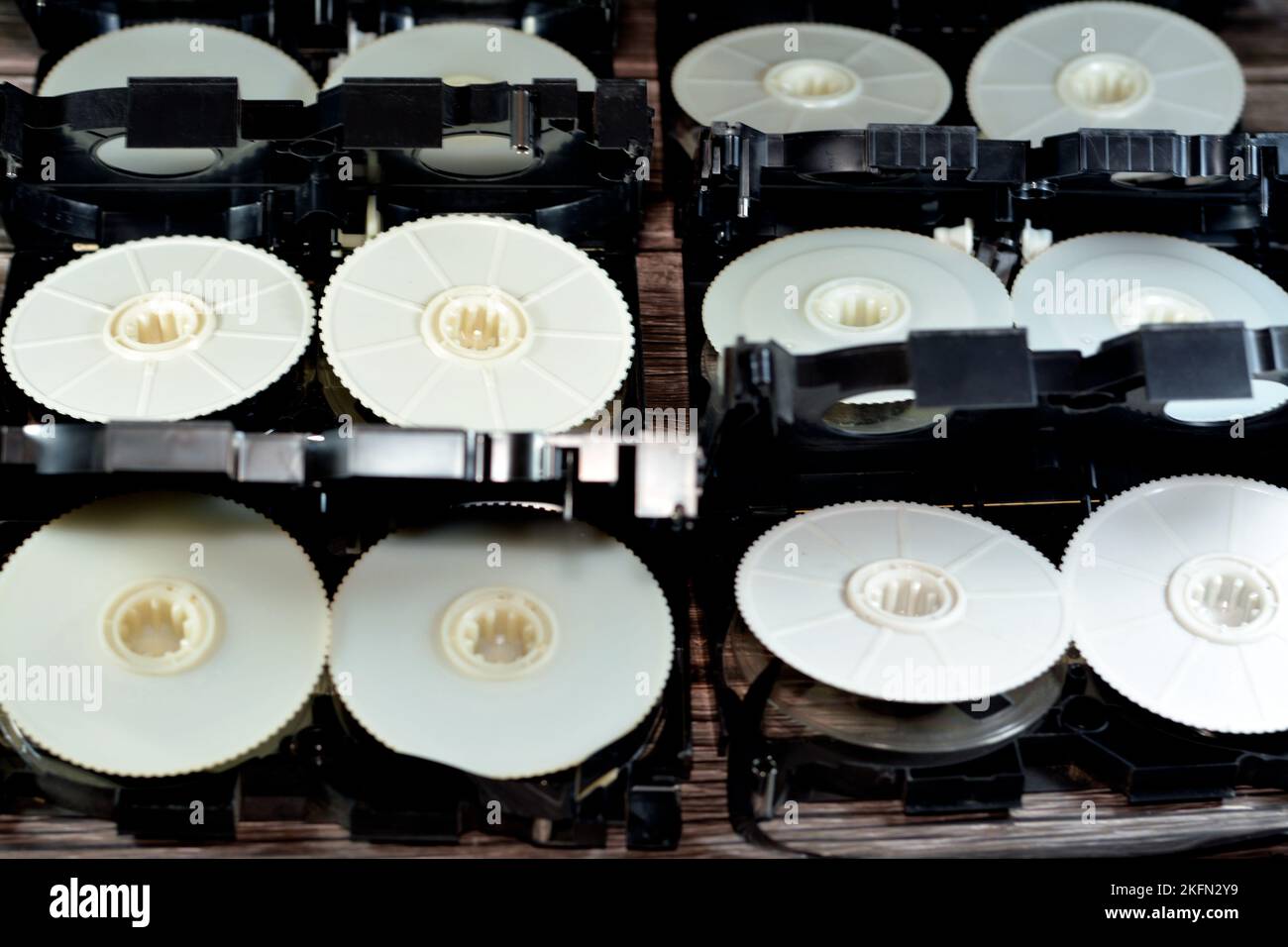 Pile of VHS video cassette tape from inside with the front casing ...