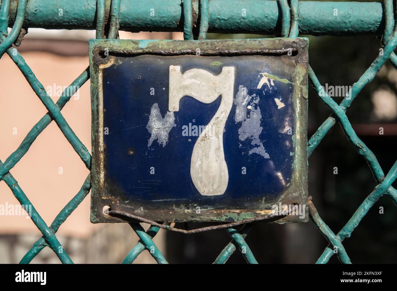 Weathered grunge square metal enameled plate of number of street ...