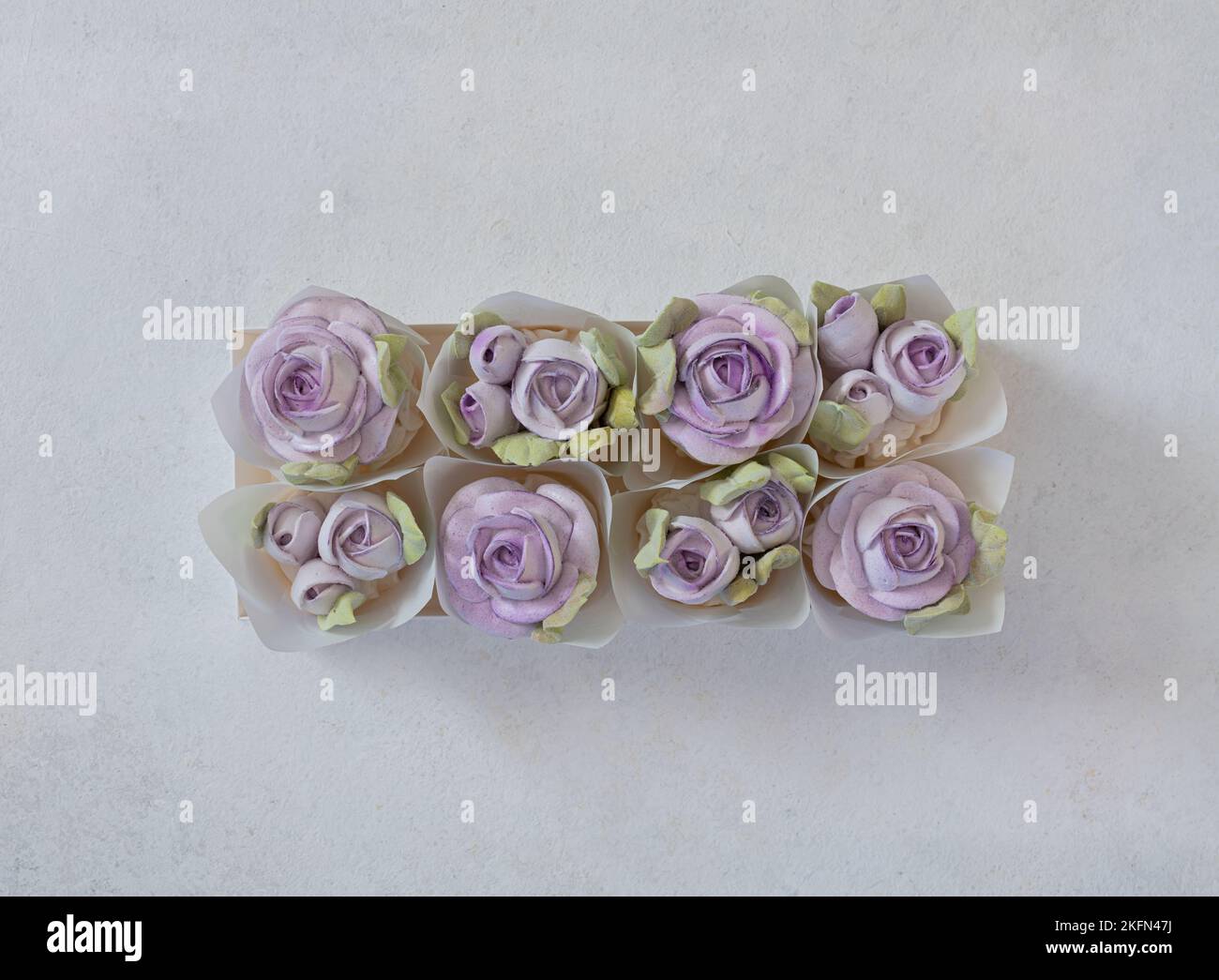 Zephyr bouquet of flowers in a gift box on a light background, top view ...