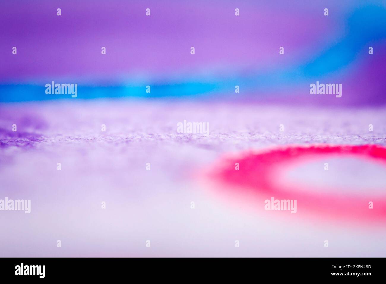 Extreme close up of purple watercolor on paper texture Selective focus ...