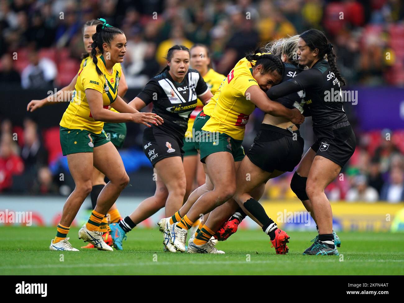 Australia's Simaima Taufa (centre) tackles New Zealand's Apii Nicholls ...