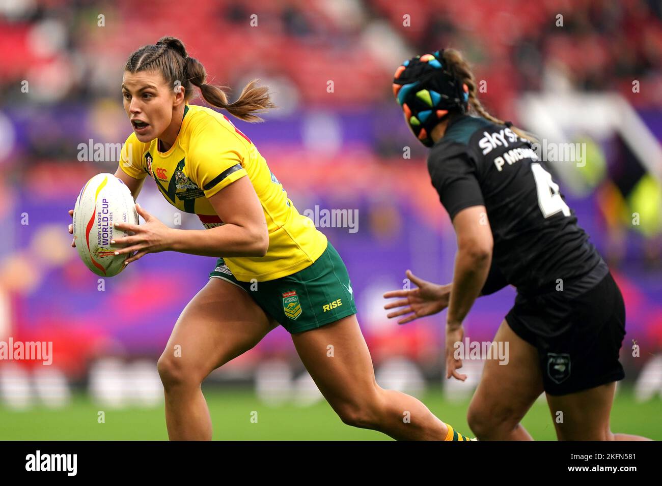 Australia's Jessica Sergis (left) gets past New Zealand's Page McGregor ...