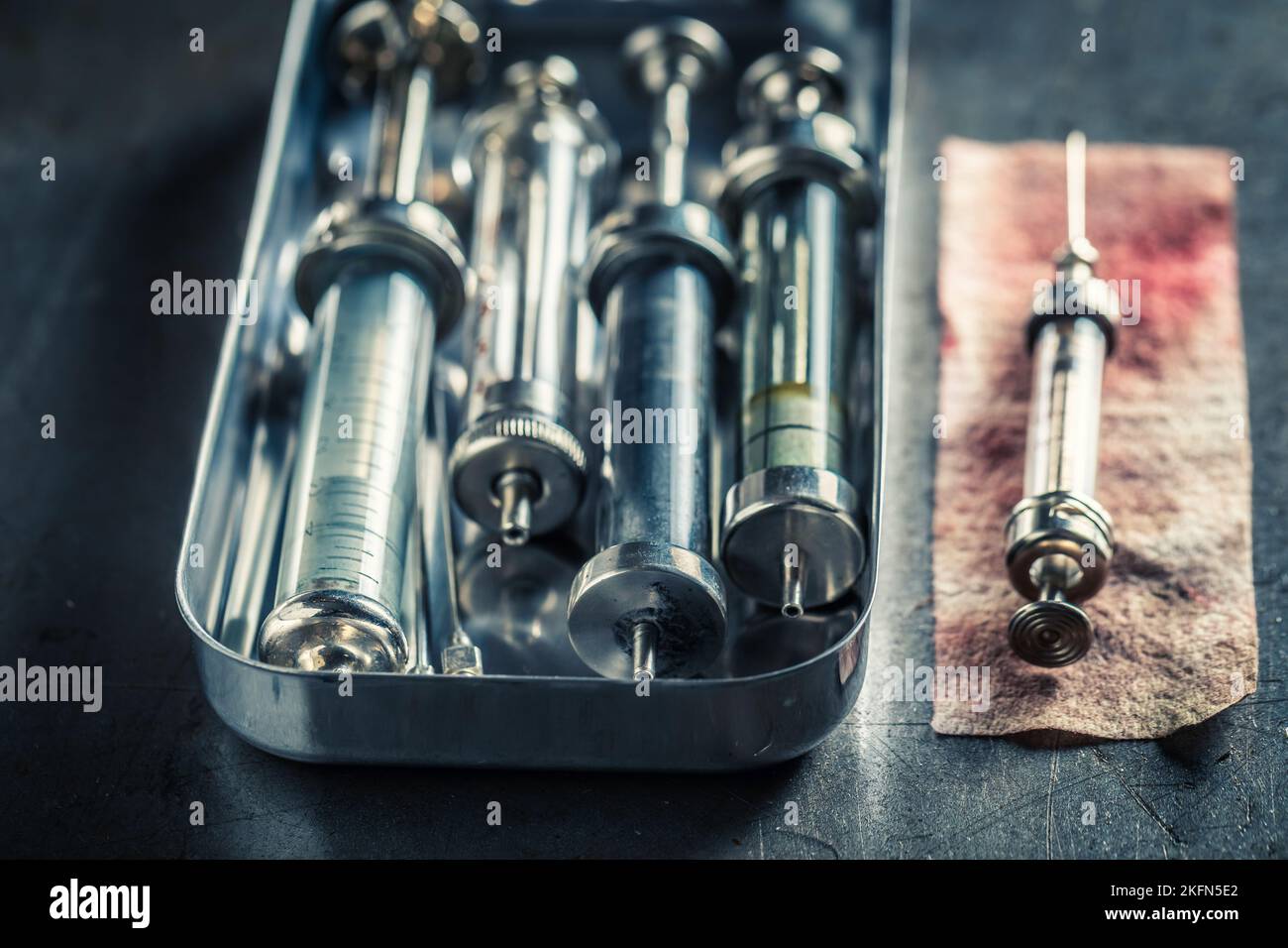 Unusable and retro needle and syringes contaminated, unusable. Old ...