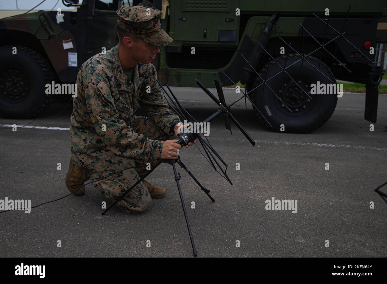 A U.S. Marine with 12th Marine Regiment establishes communications in ...