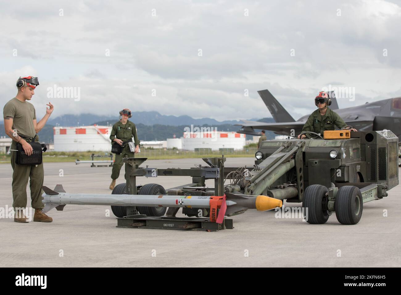 U.S. Marines with Marine Fighter Attack Squadron (VMFA) 121 transport ...