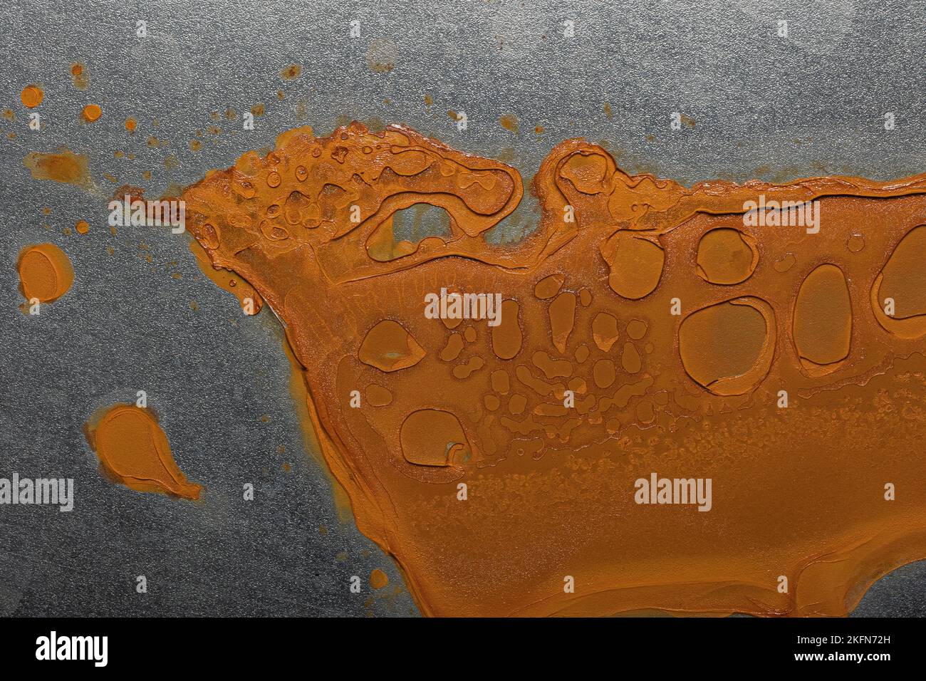 A layer of orange rust on weathered steel surface Stock Photo - Alamy