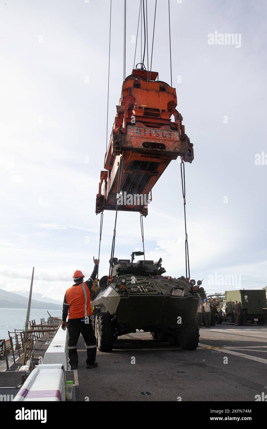 A local contractor assists with a vehicle offload in preparation for ...