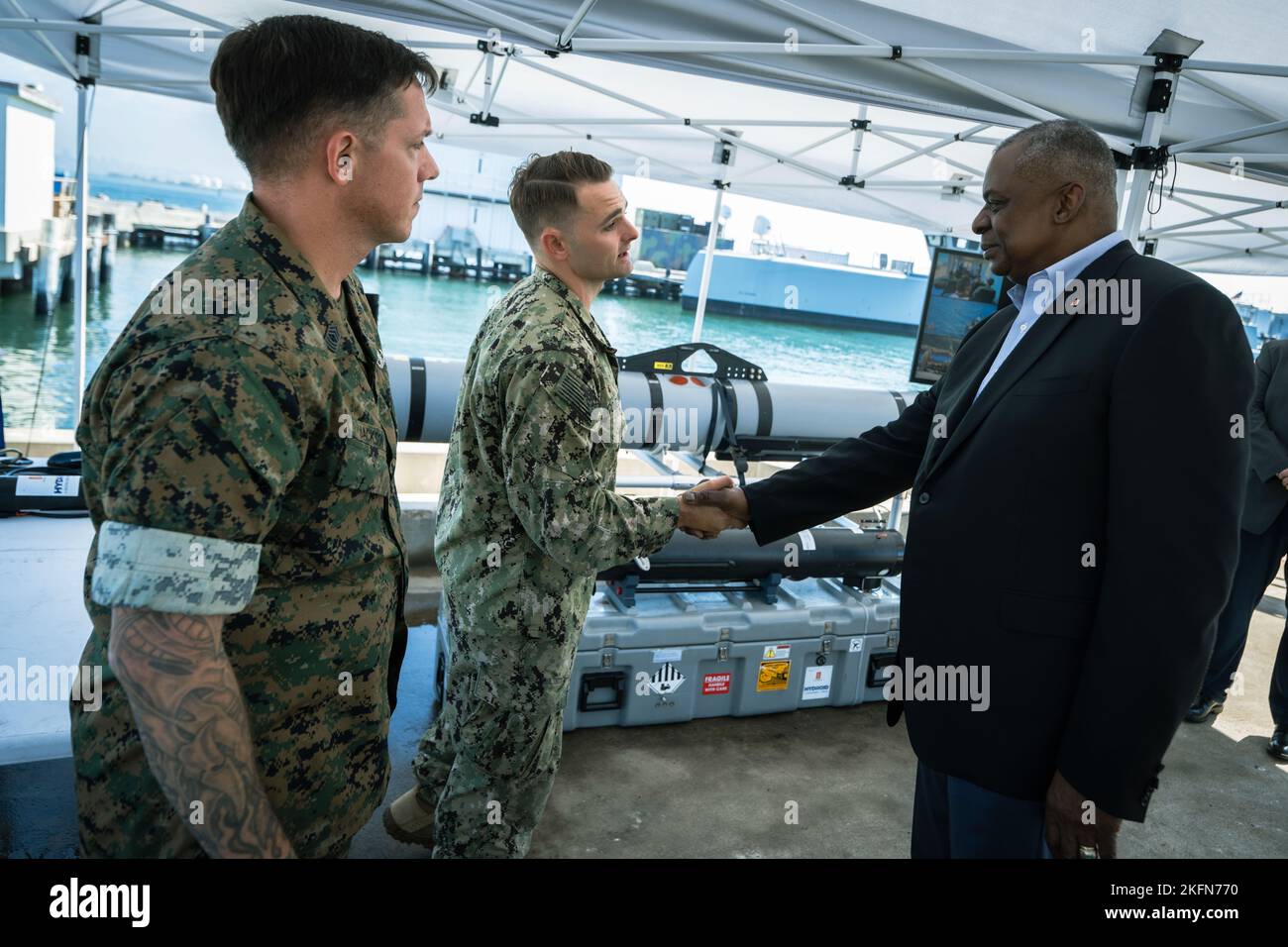 Secretary of Defense Lloyd J. Austin III greets U.S. Navy Lt. Andrew ...
