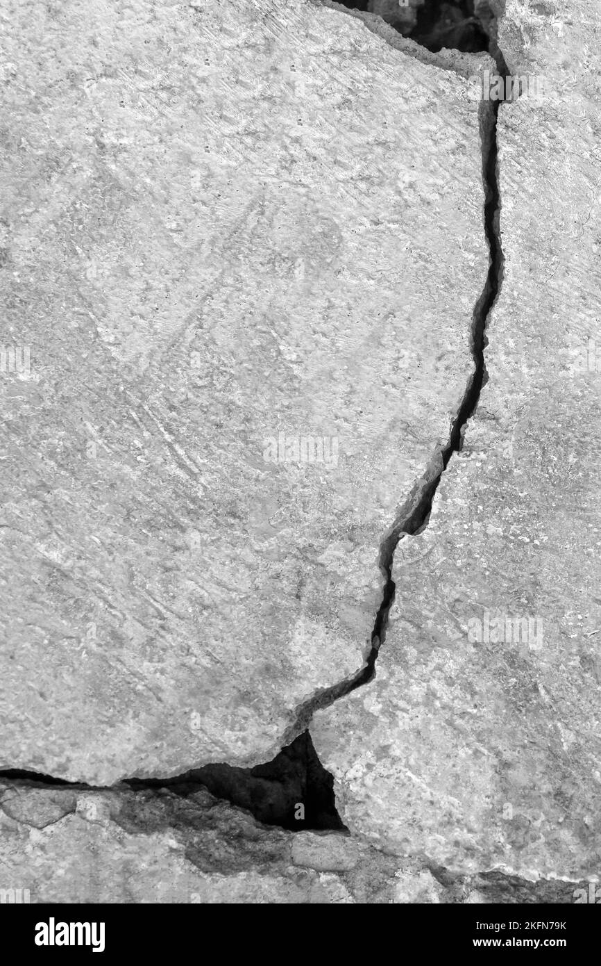 Big crack on gray wall, abstract image of vertical cleft. Close-up ...
