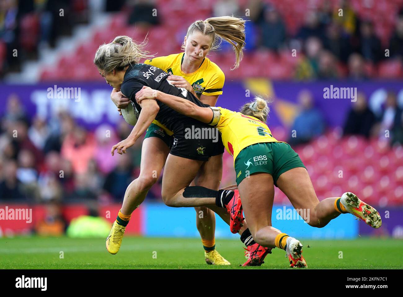 New Zealand's Apii Nicholls is tackled by Australia's Emma Tonegato and ...