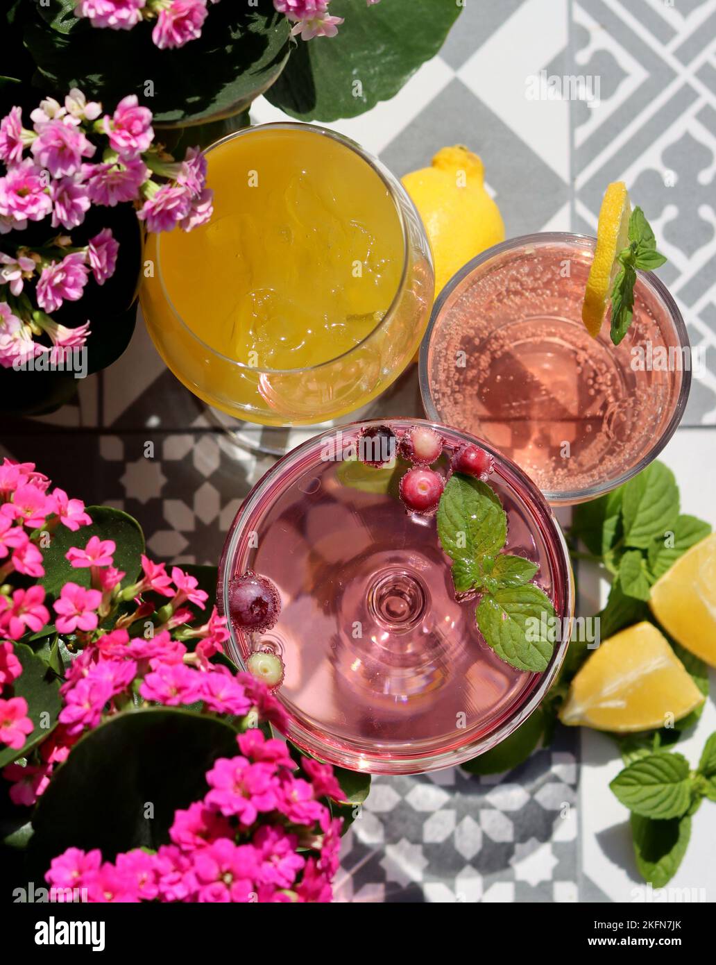 Refreshing summer cocktails on a garden table. Close up photo of ...